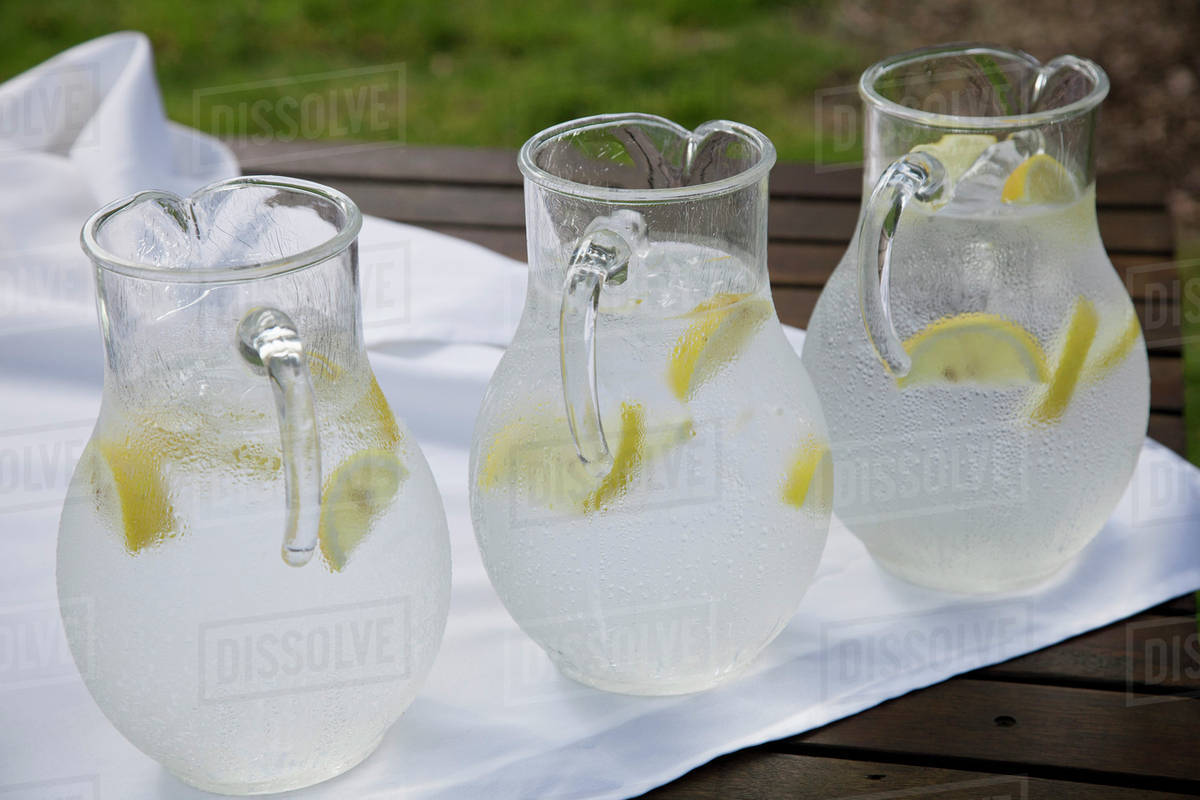 Three pitchers of ice water with lemon slices - Royalty-free Stock ...